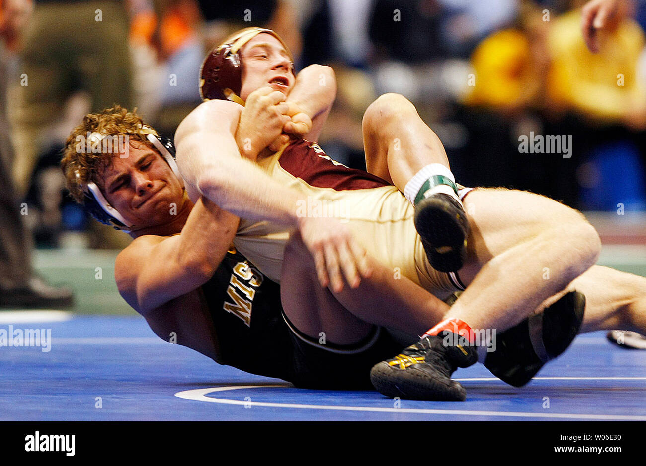 Missouri's Maxwell Askren (L) ties up Wynn Michalak of Central Michigan ...