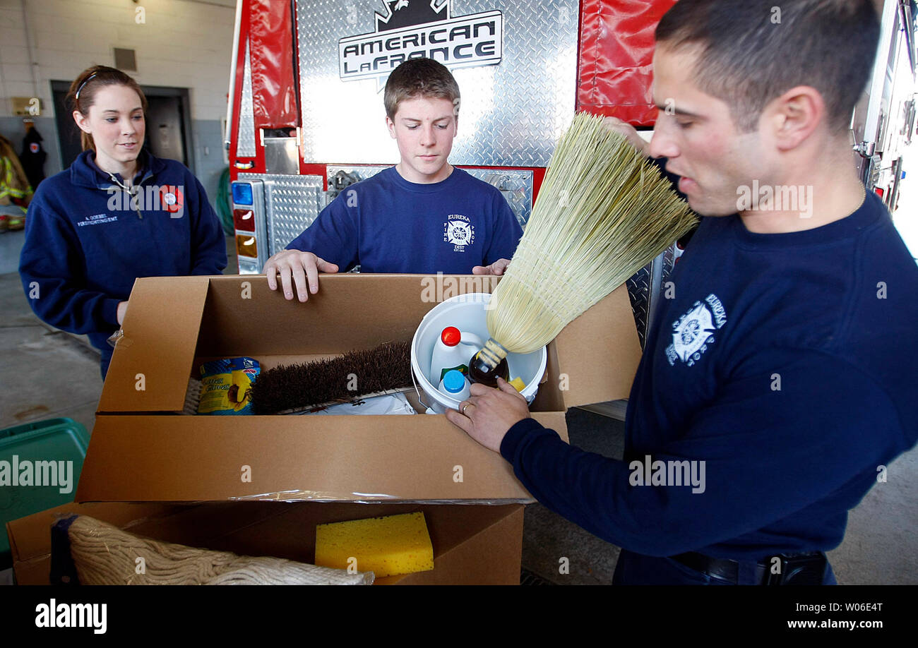 Eureka Fire Department Explorer Scouts examine a clean-up kit that will ...
