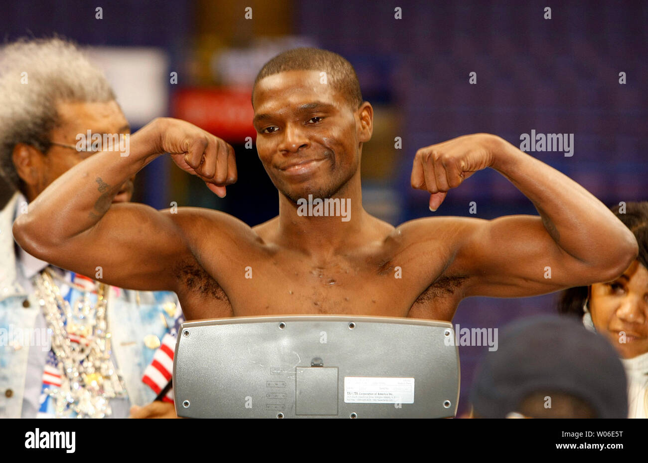 Boxer Cory Spinks flexes during weigh-ins at the Scottrade Center in St ...