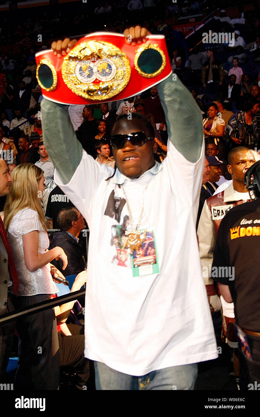 New England Patriots Laurence Maroney holds the championship belt of ...