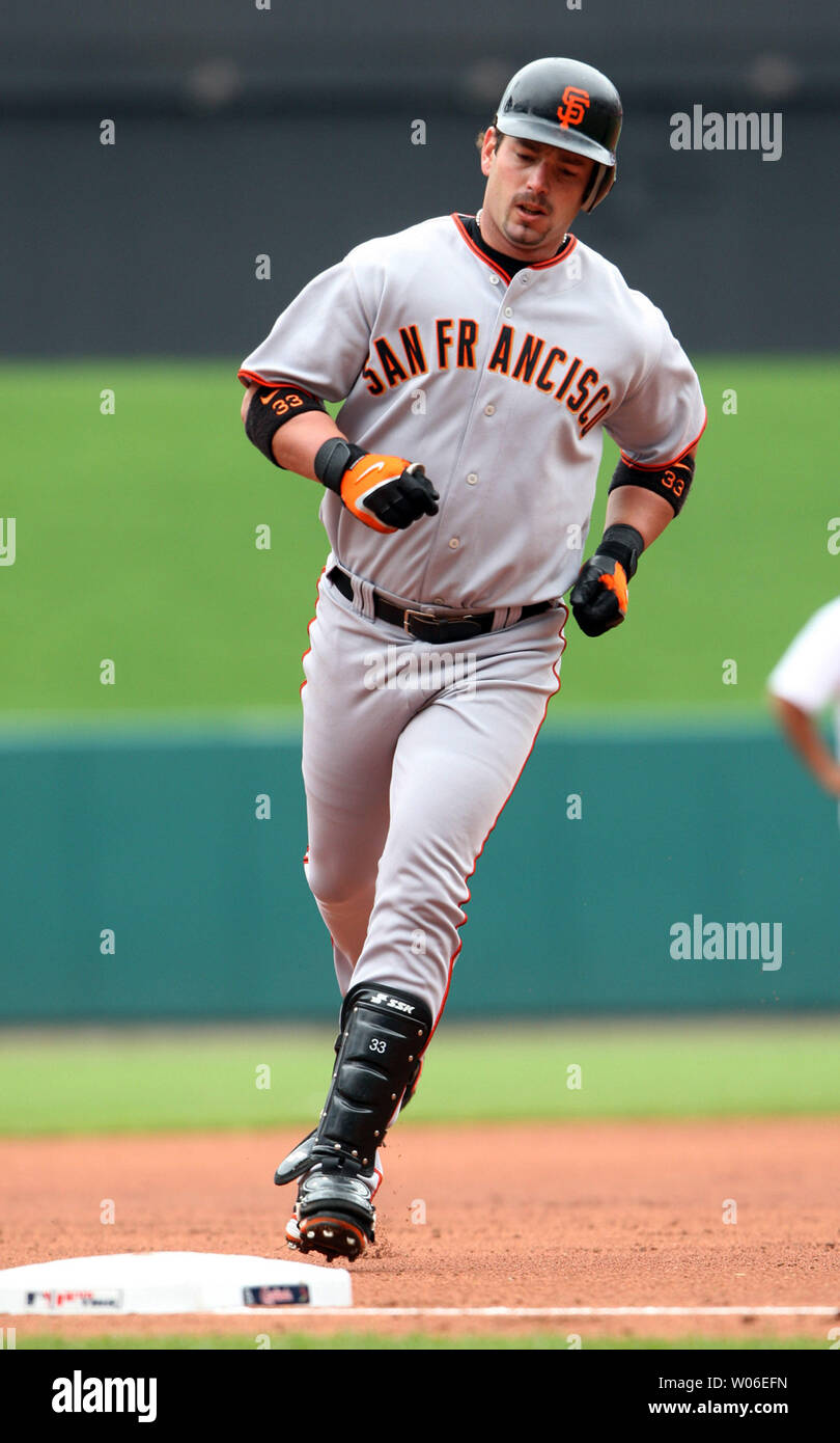 San Francisco Giants Aaron Rowand crosses third base after hitting a ...