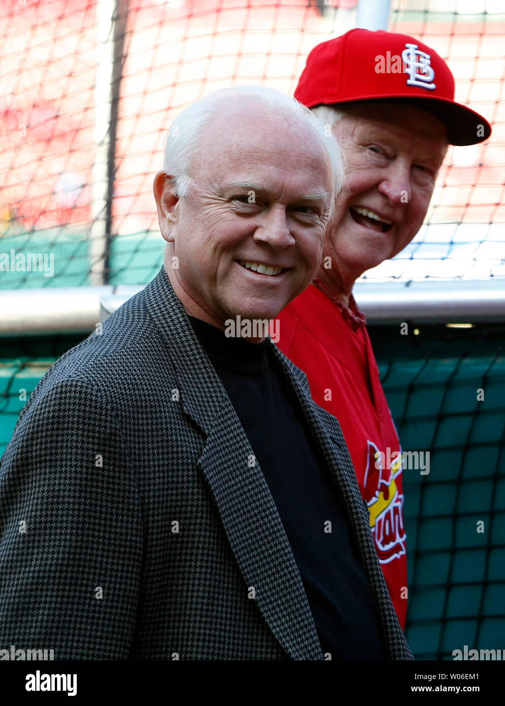 Cincinnati Reds General Manager Walt Jocketty (L) says hello to fans as ...