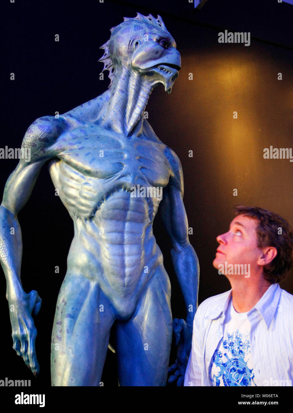 Academy Award-winning animatronics expert John Cox inspects the display ...