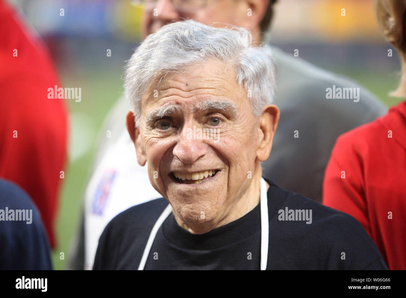 Well known organist Stan Kann appears on the field for a ceremony ...
