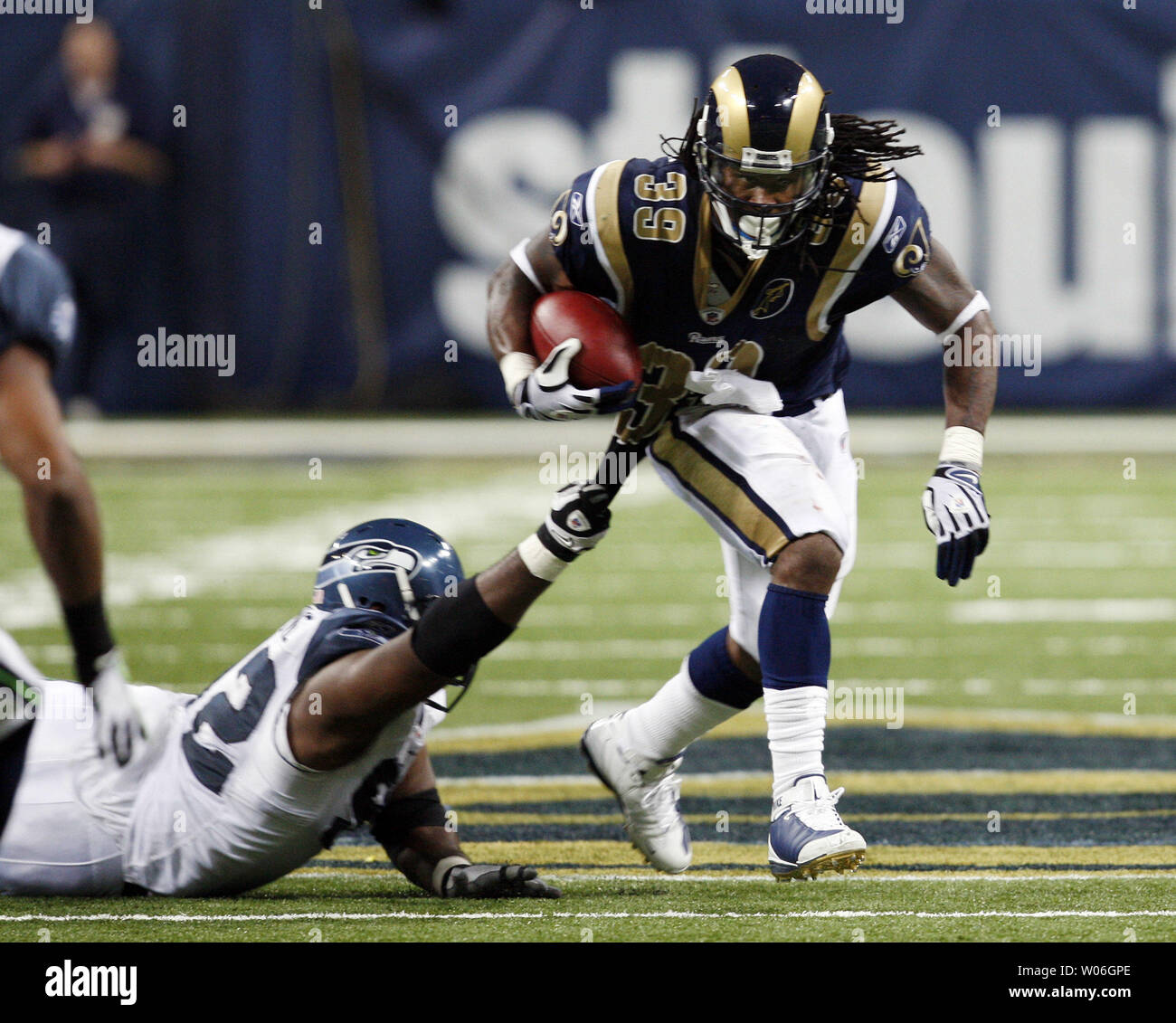 Seattle Seahawks Brandon Mebane (L) gets a piece St. Louis Rams Steven ...