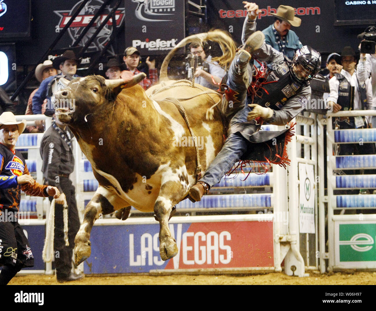 Bull rider Wiley Peterson from Fort Hall, ID is thrown from the back of ...