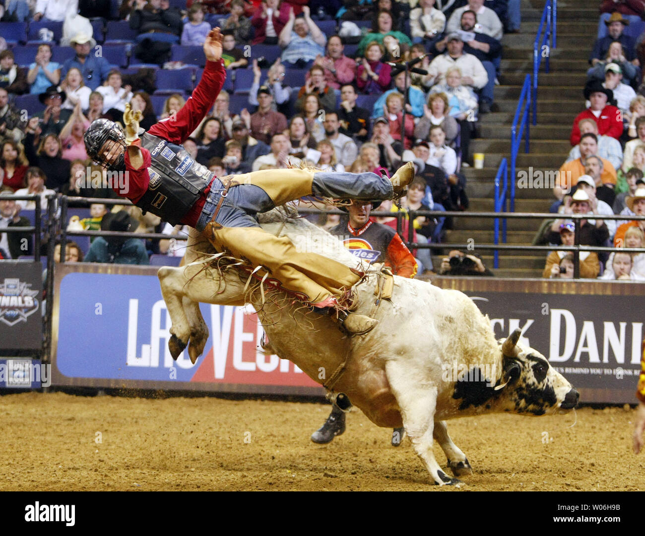 Bull rider Ross Coleman of Molalla, OR is thrown clear by bull Booger ...