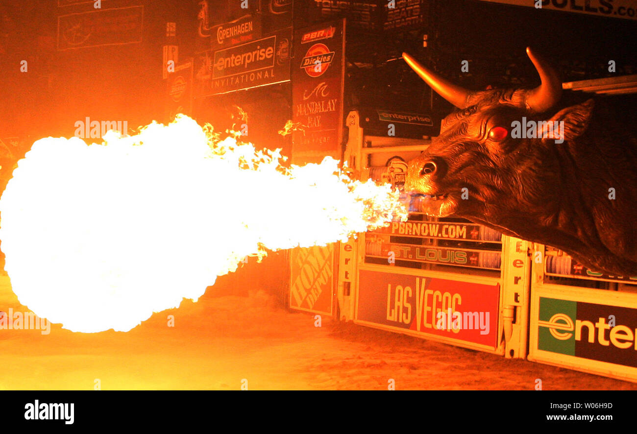 Flames shoot from the mouth of a display bull during the opening ...