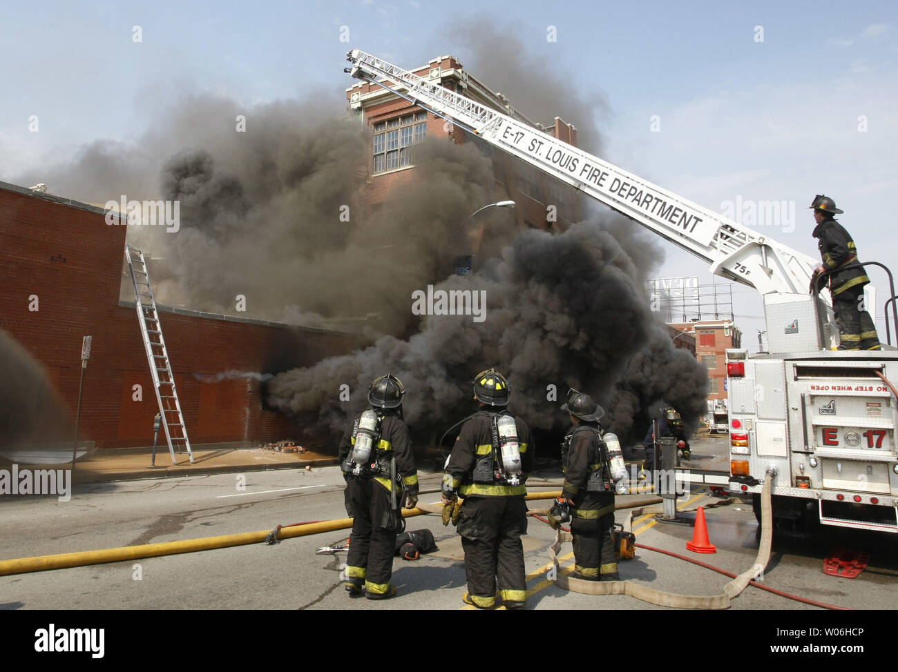 St. Louis firefighters fight a three-alarm fire at a vacant three story ...