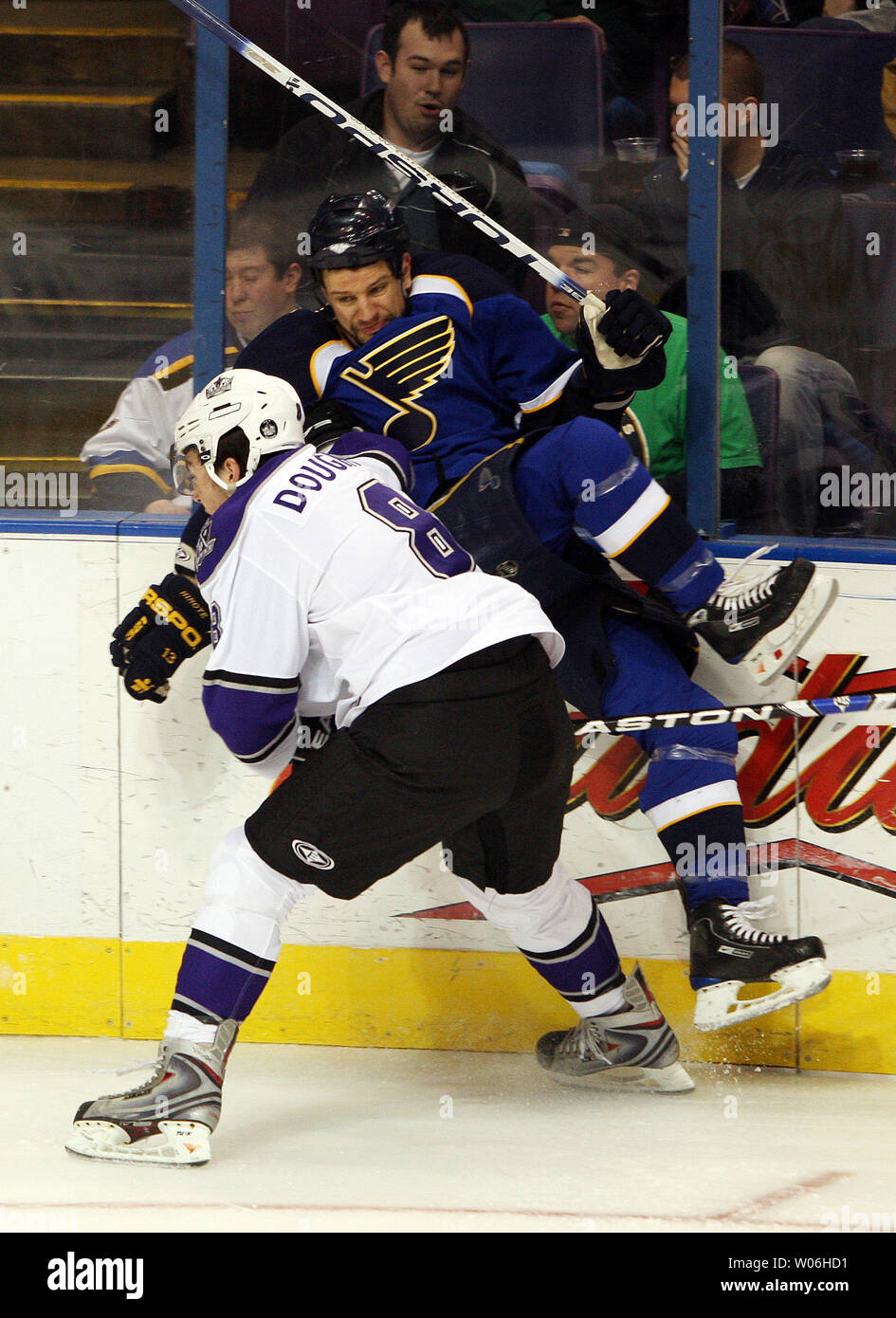 Los Angeles Kings Drew Doughty (L) puts St. Louis Blues Dan Hinote hard ...