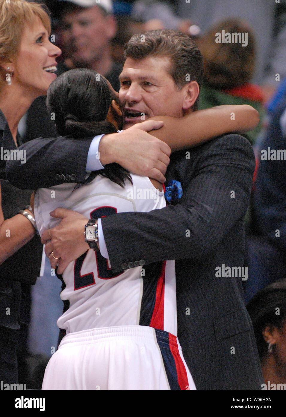 Connecticut women's head basketball coach Geno Auriemma embraces player ...