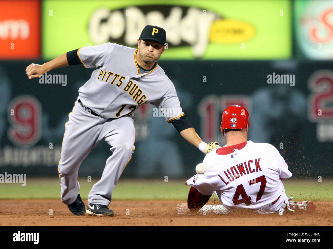 St. Louis Cardinals Ryan Ludwick (47) knocks the baseball free from the ...