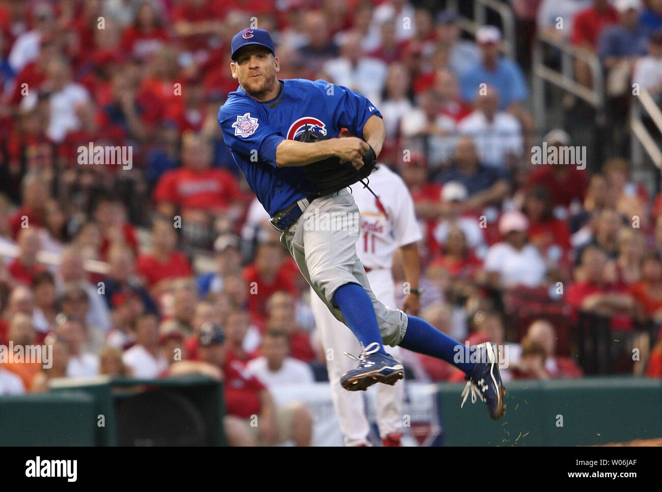 Chicago Cubs third baseman Ryan Freel comes up throwing to get St ...