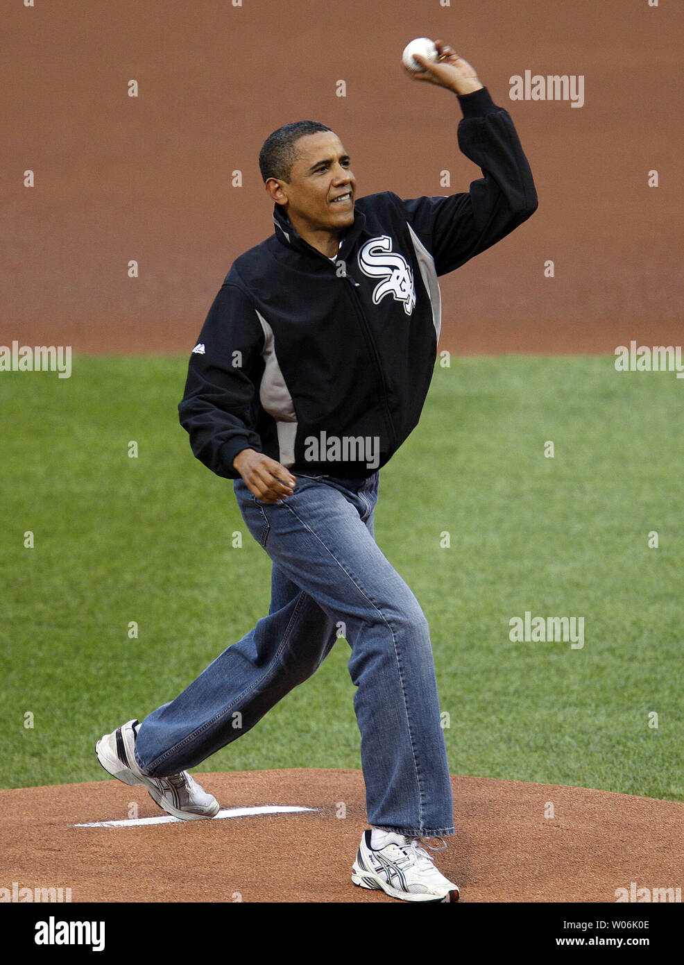 U.S. President Barack Obama delivers an honorary first pitch before the ...
