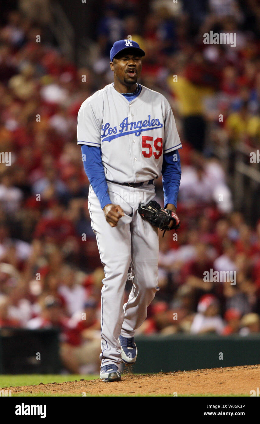 Los Angeles Dodgers pitcher Guillermo Mota cringes after giving up a ...