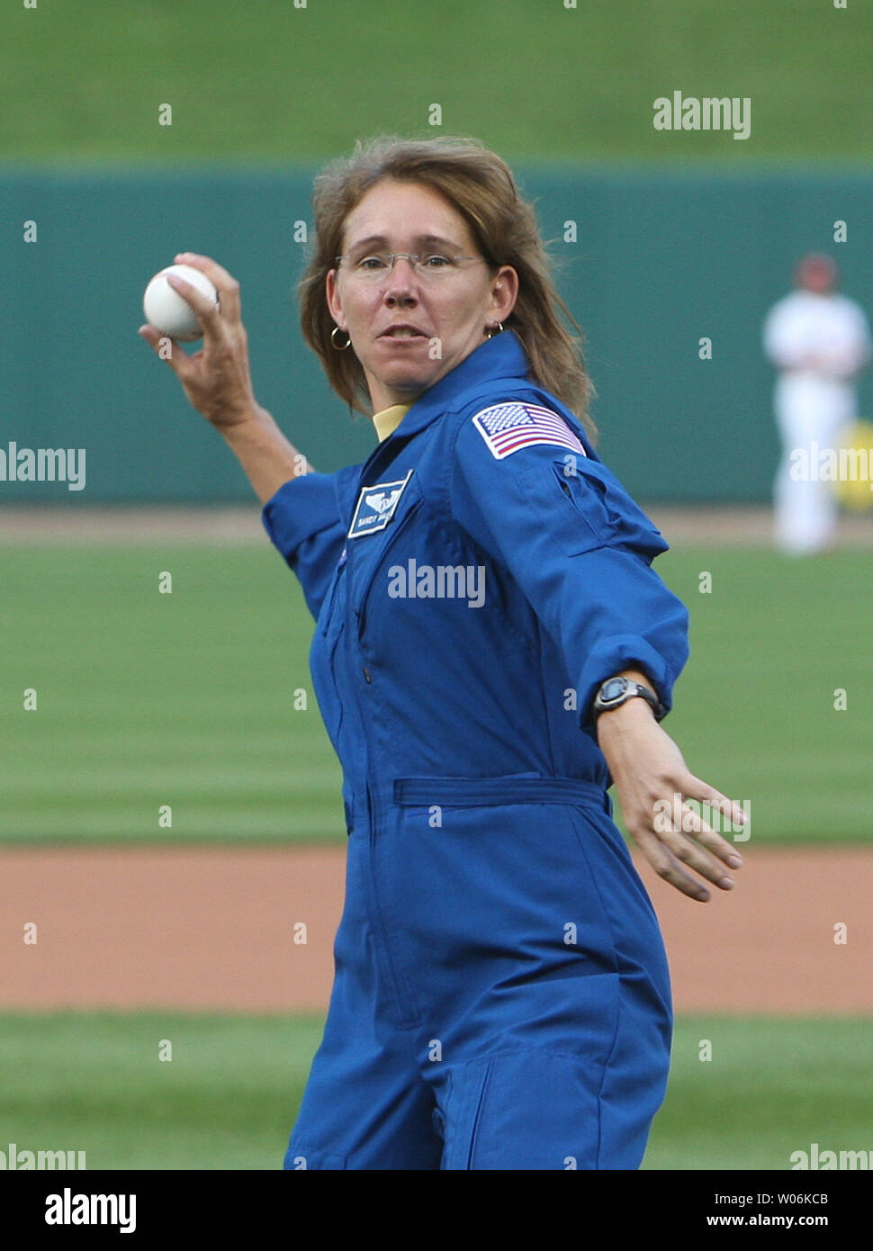 Astronaut Sandy Magnus throws out a ceremonial first pitch before the ...