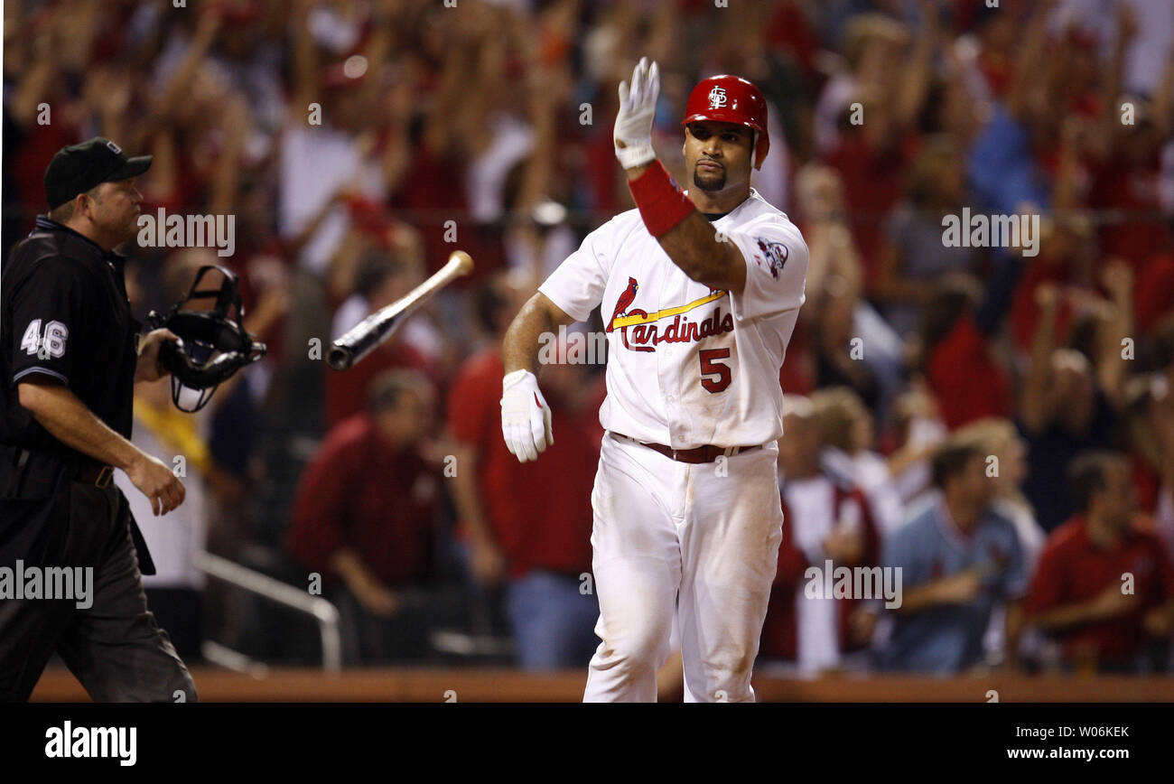 St. Louis Cardinals Albert Pujols flips his bat as he begins his home ...