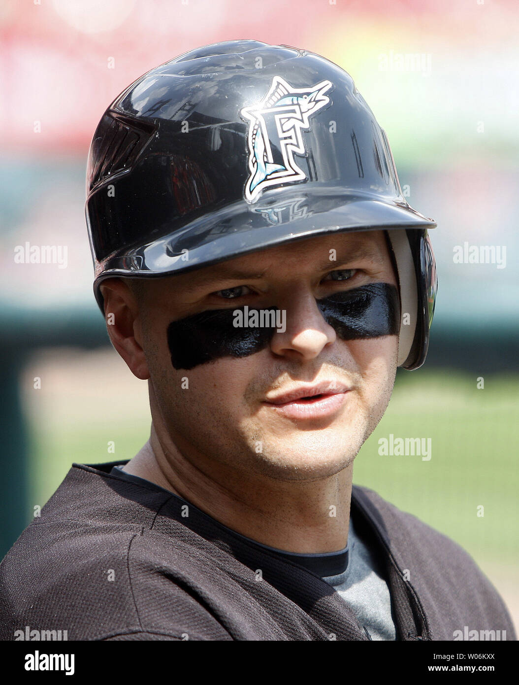 Florida Marlins Cody Ross waits in the dugout before going to the ...