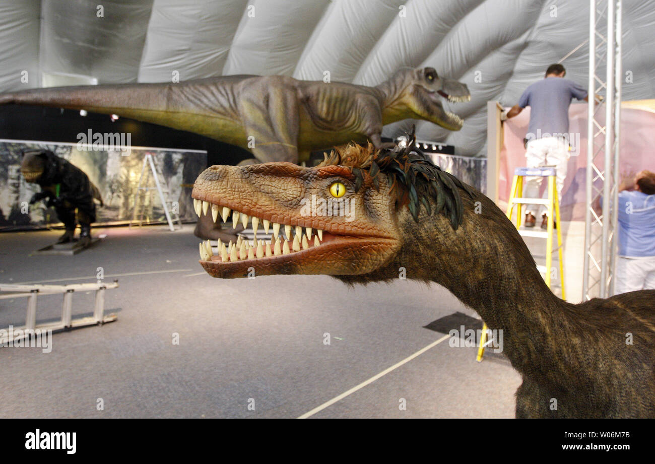 Workers put the finishing touches on the Dinosaurs Unearthed display at ...