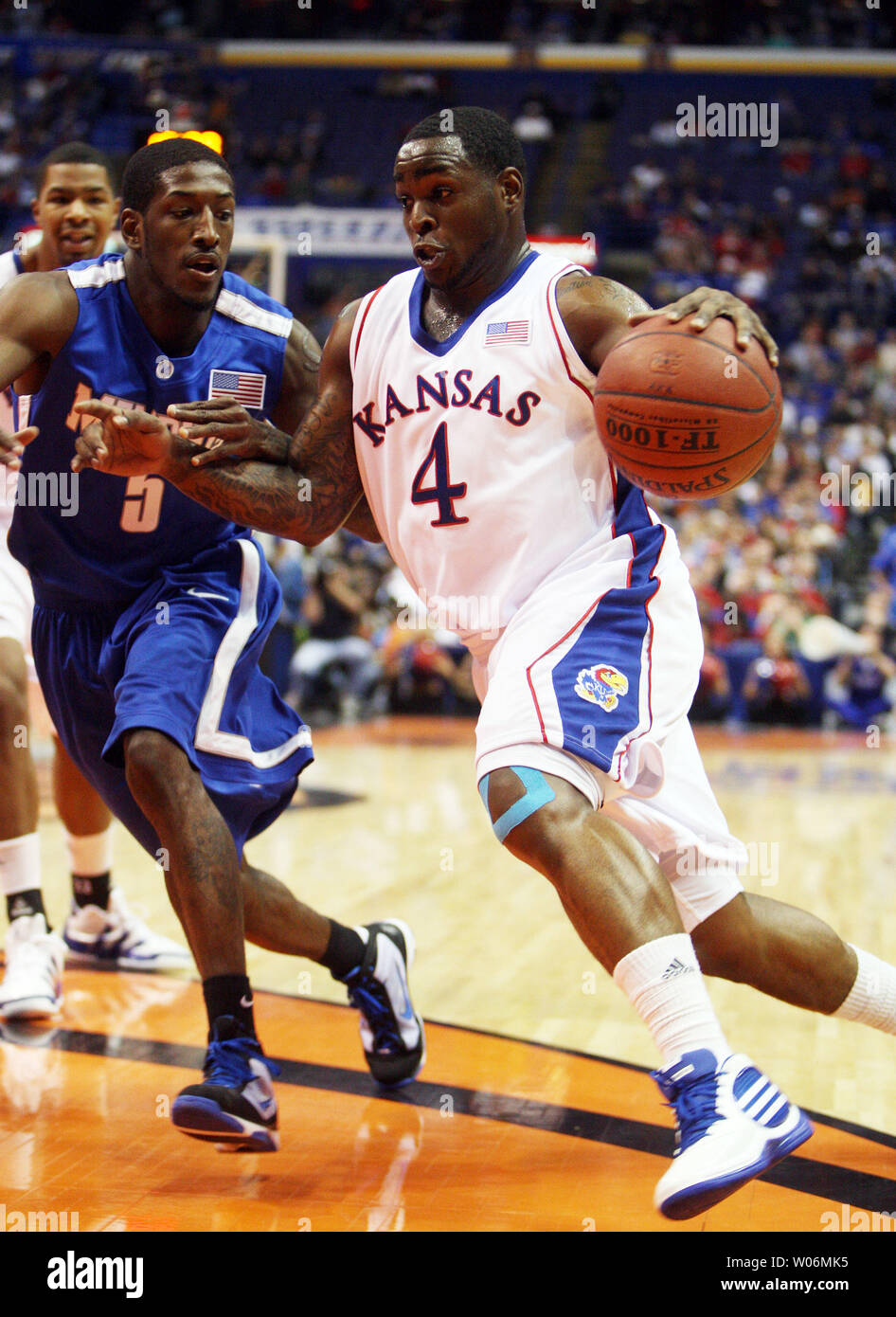 Kansas Jayhawks Sherron Collins (4) turns the corner on Memphis Tigers ...