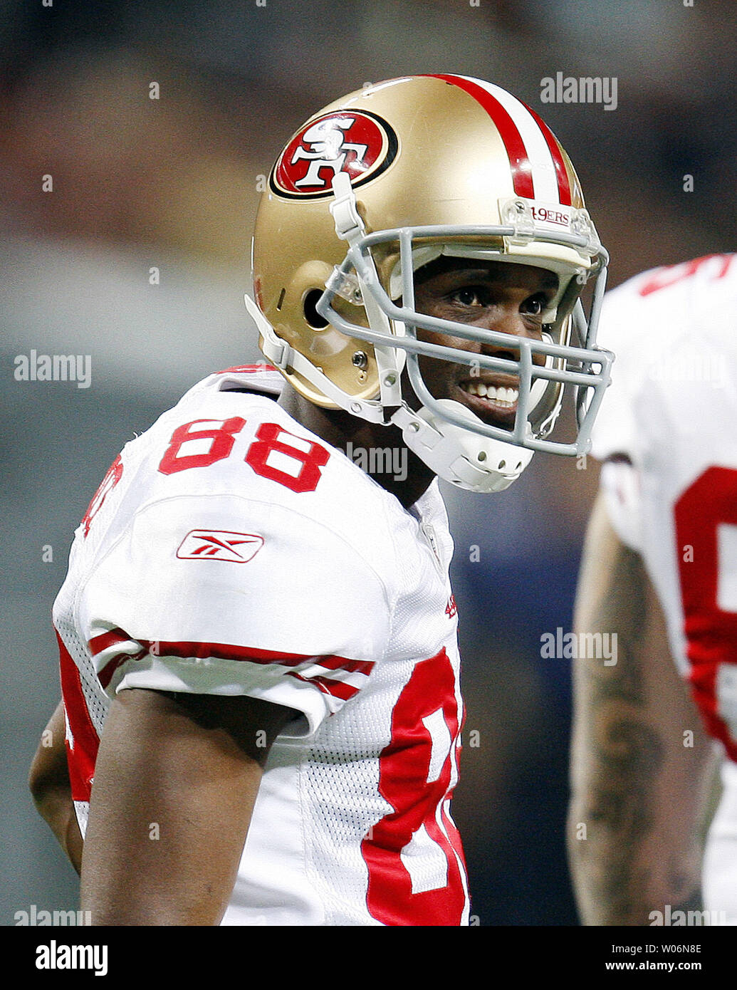San Francisco 49ers Isaac Bruce smiles to the stands as his team ...