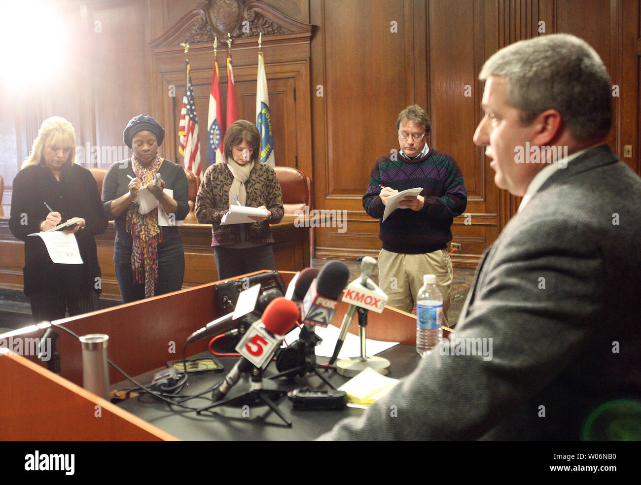 Captain Michael Sack of the St. Louis Police Department briefs ...