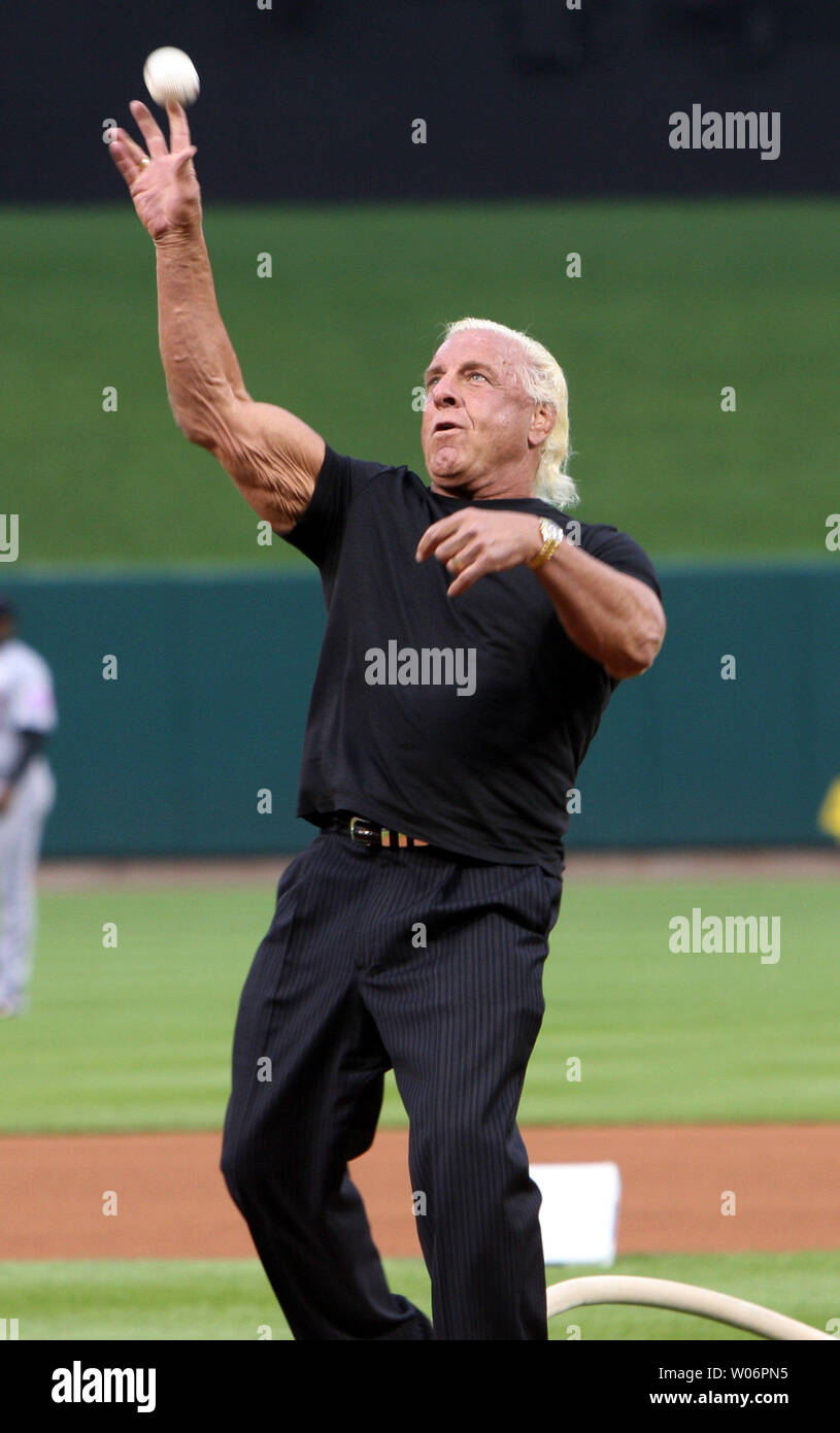 Professional wrestler Rick Flair throws a ceremonial first pitch before ...