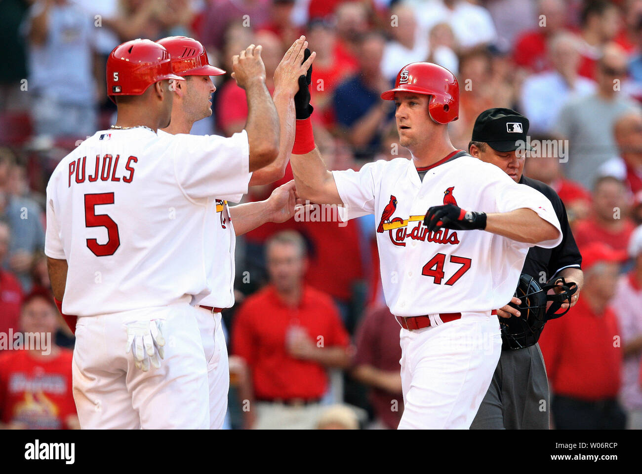 St. Louis Cardinals Ryan Ludwick (47) is greeted at home plate by ...