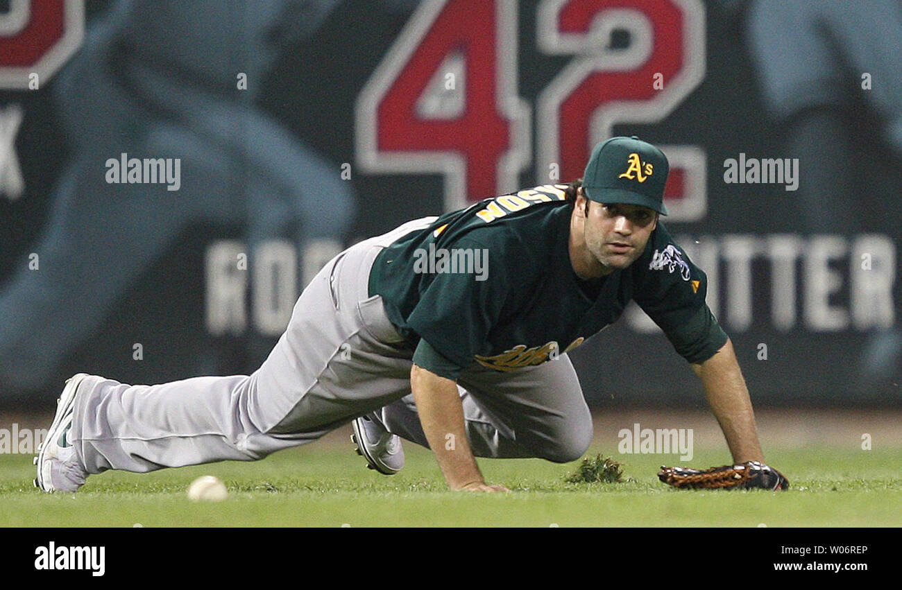 Oakland A's left fielder Conner Jackson falls to the ground as a ...