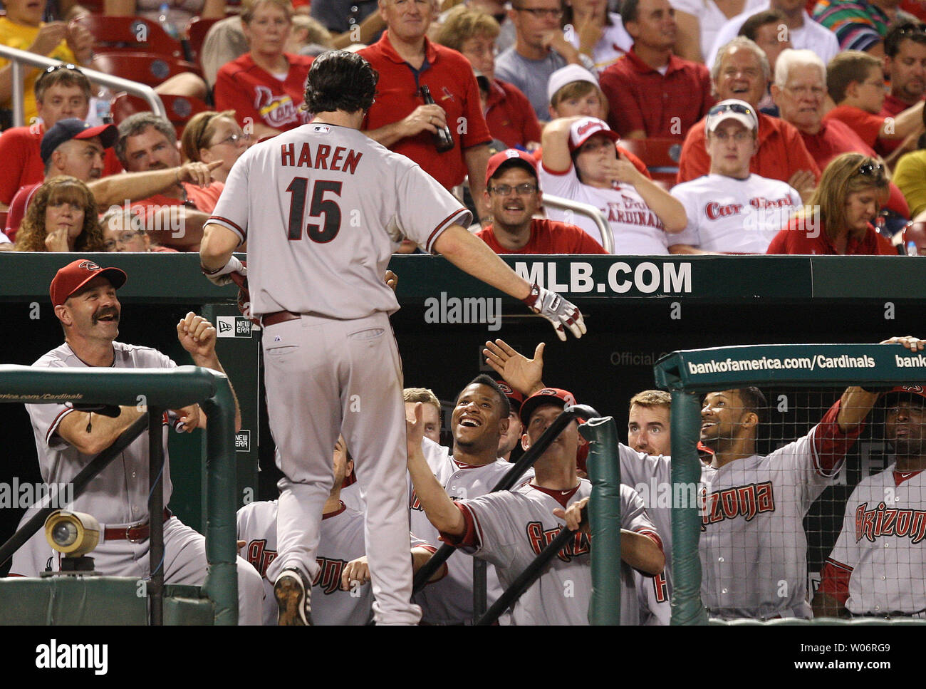 Arizona Diamondbacks Dan Haren is welcomed into the dugout after ...