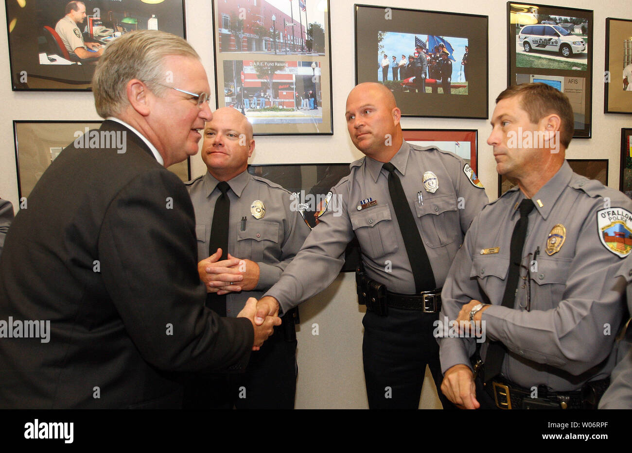 Missouri Governor Jay Nixon greets O'Fallon Police officers before ...