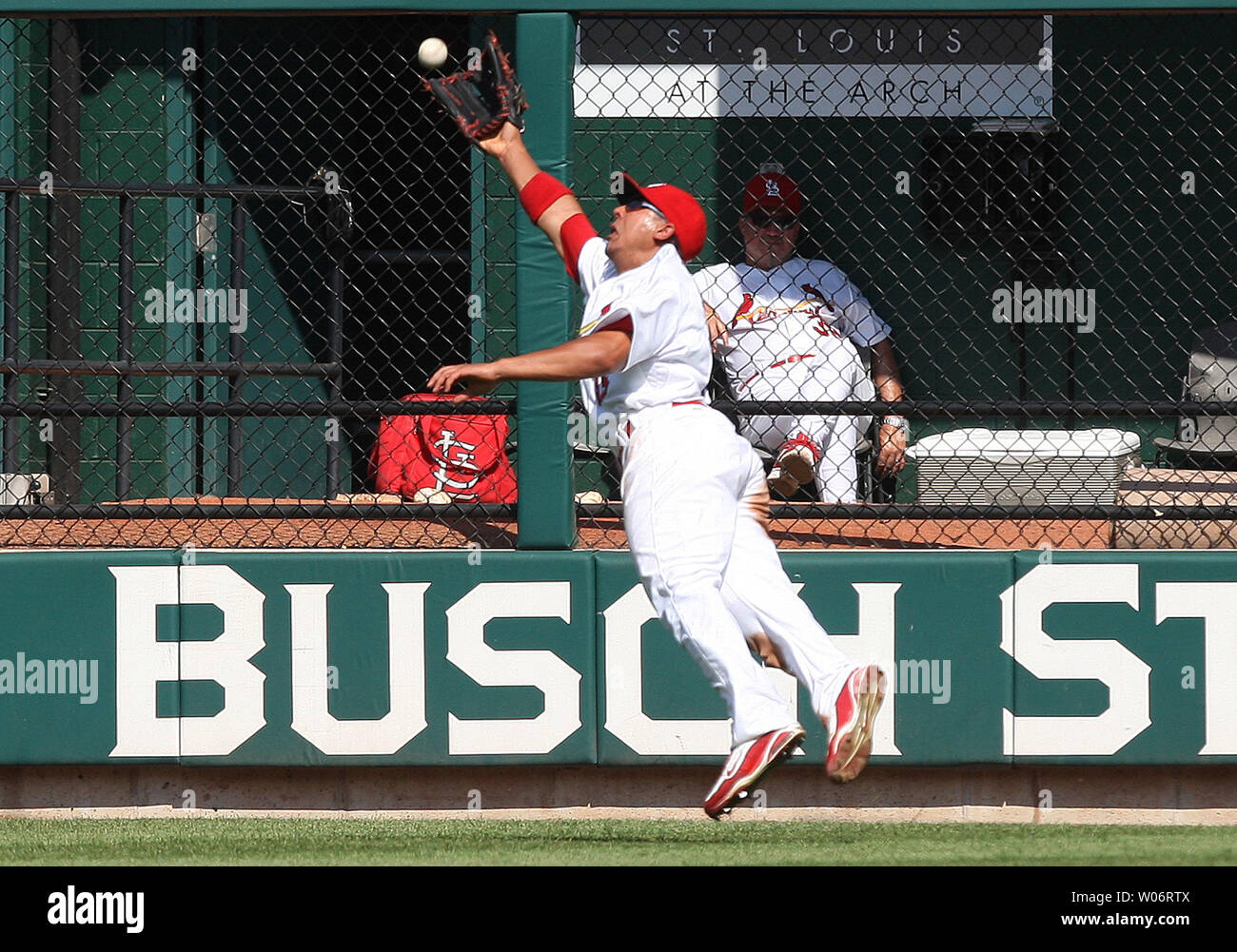 St. Louis Cardinals Jon Jay makes a leaping attempt at a baseball off ...