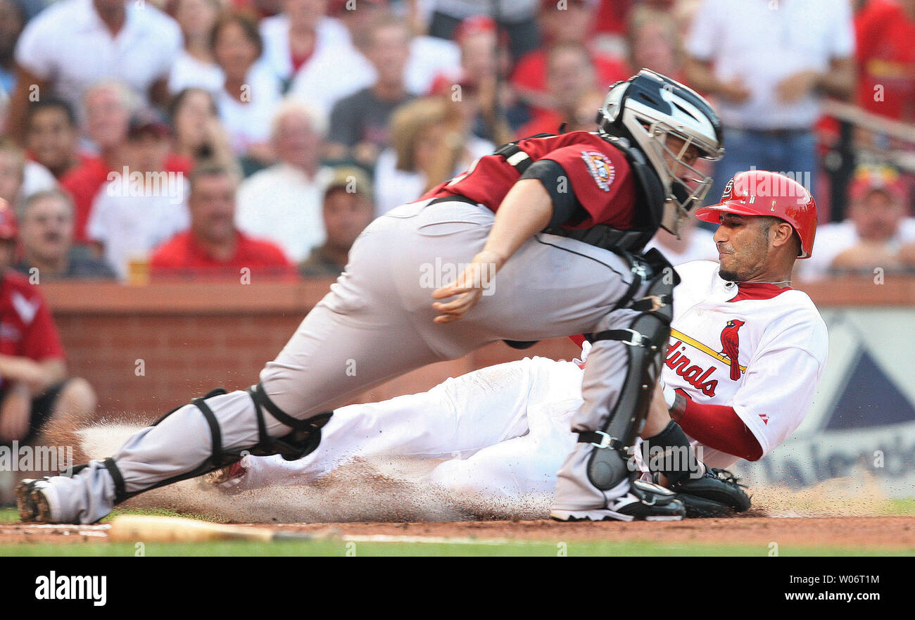 St. Louis Cardinals Felipe Lopez slides past the tag of Houston Astros ...