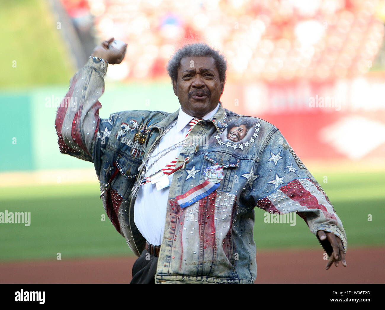 Boxing promotor Don King throws a ceremonial first pitch before the ...