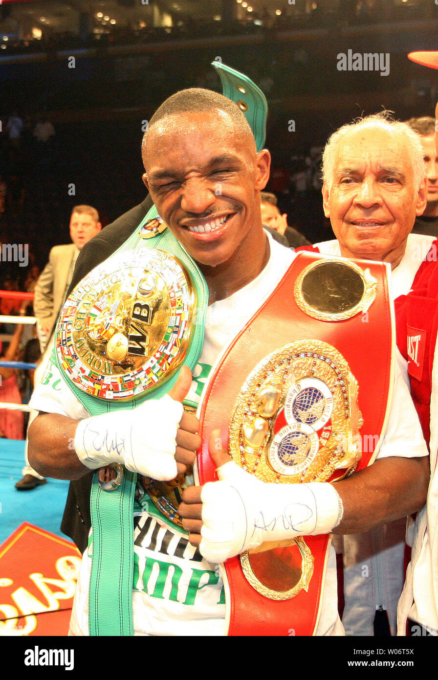Boxer Devon Alexander smiles as he hold his belts after defeating ...