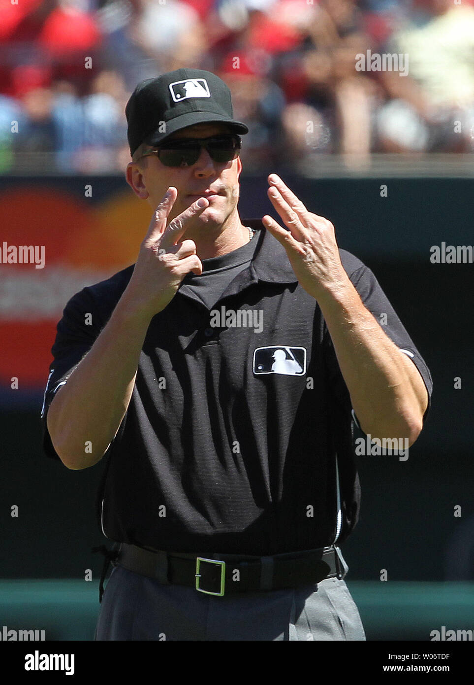 Second base umpire Jeff Kellogg lets everyone know the three and two ...