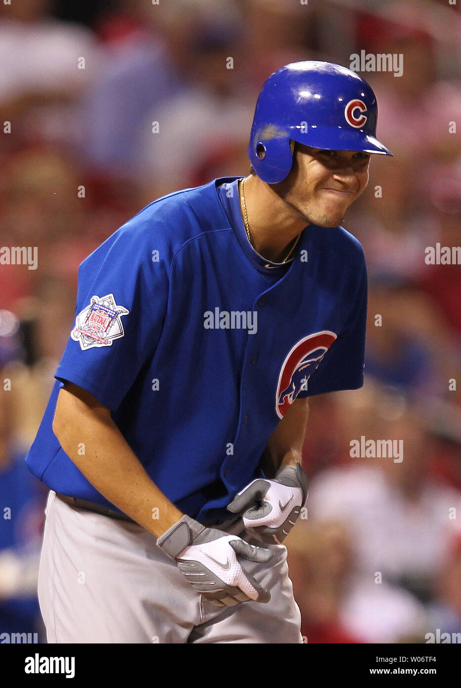 Chicago Cubs Tyler Colvin goes to first base after being hit on the ...