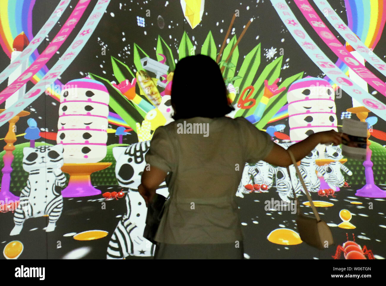 27th June, 2019. Visual tech exhibition A visitor experiences a hands ...