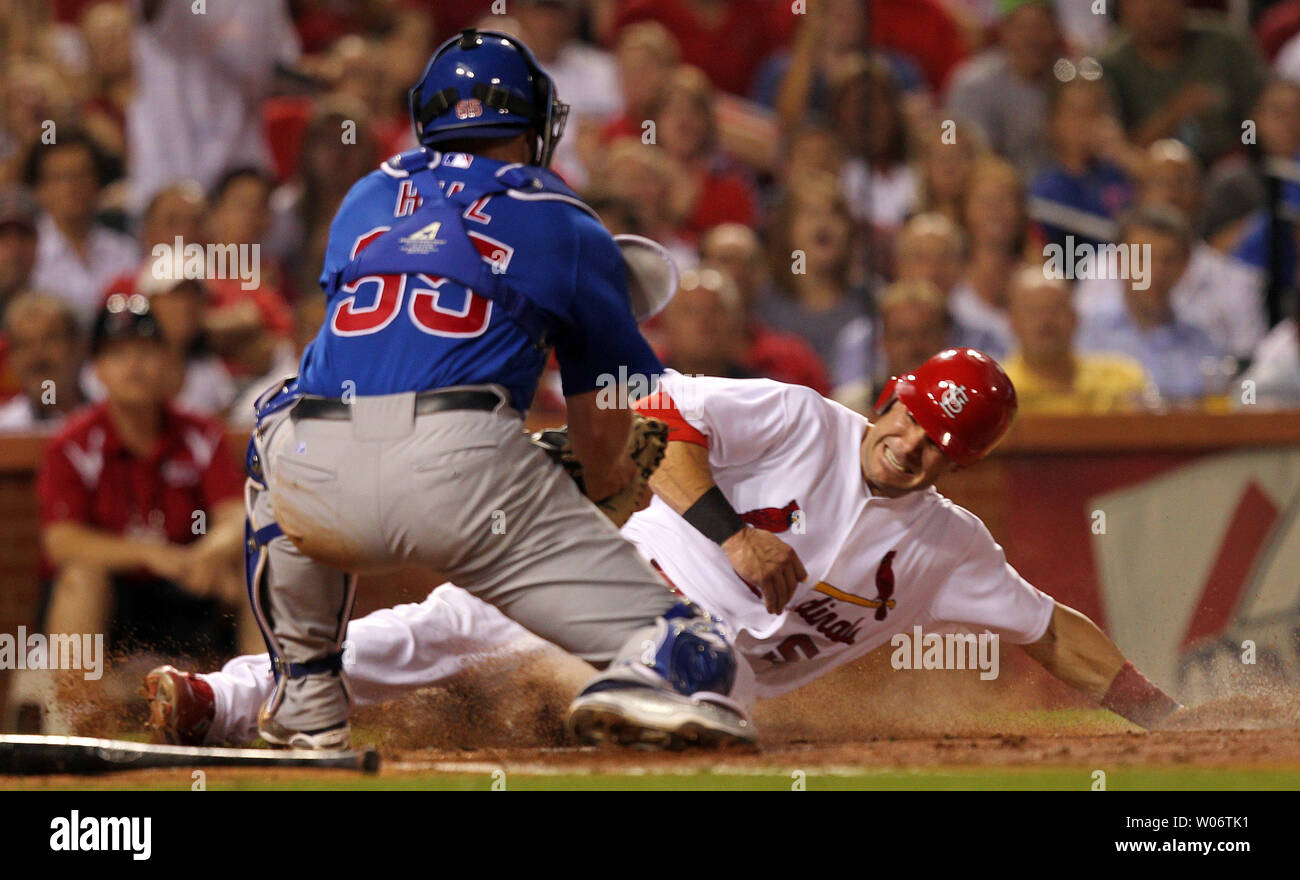 St. Louis Cardinals Skip Schumaker slides safely past Chicago Cubs ...