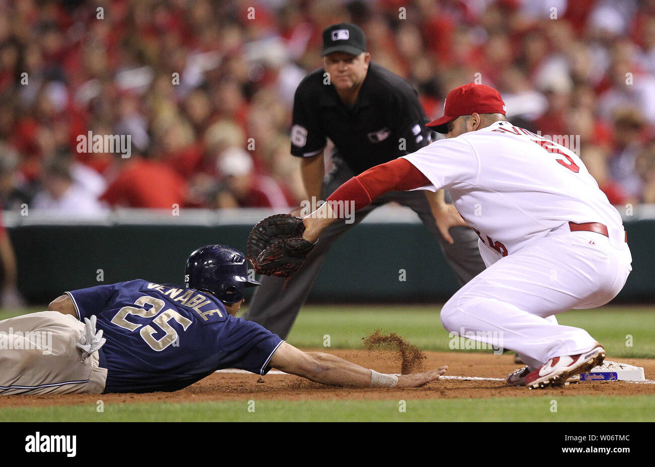 St. Louis Cardinals first baseman Albert Pujols just misses the tag on ...