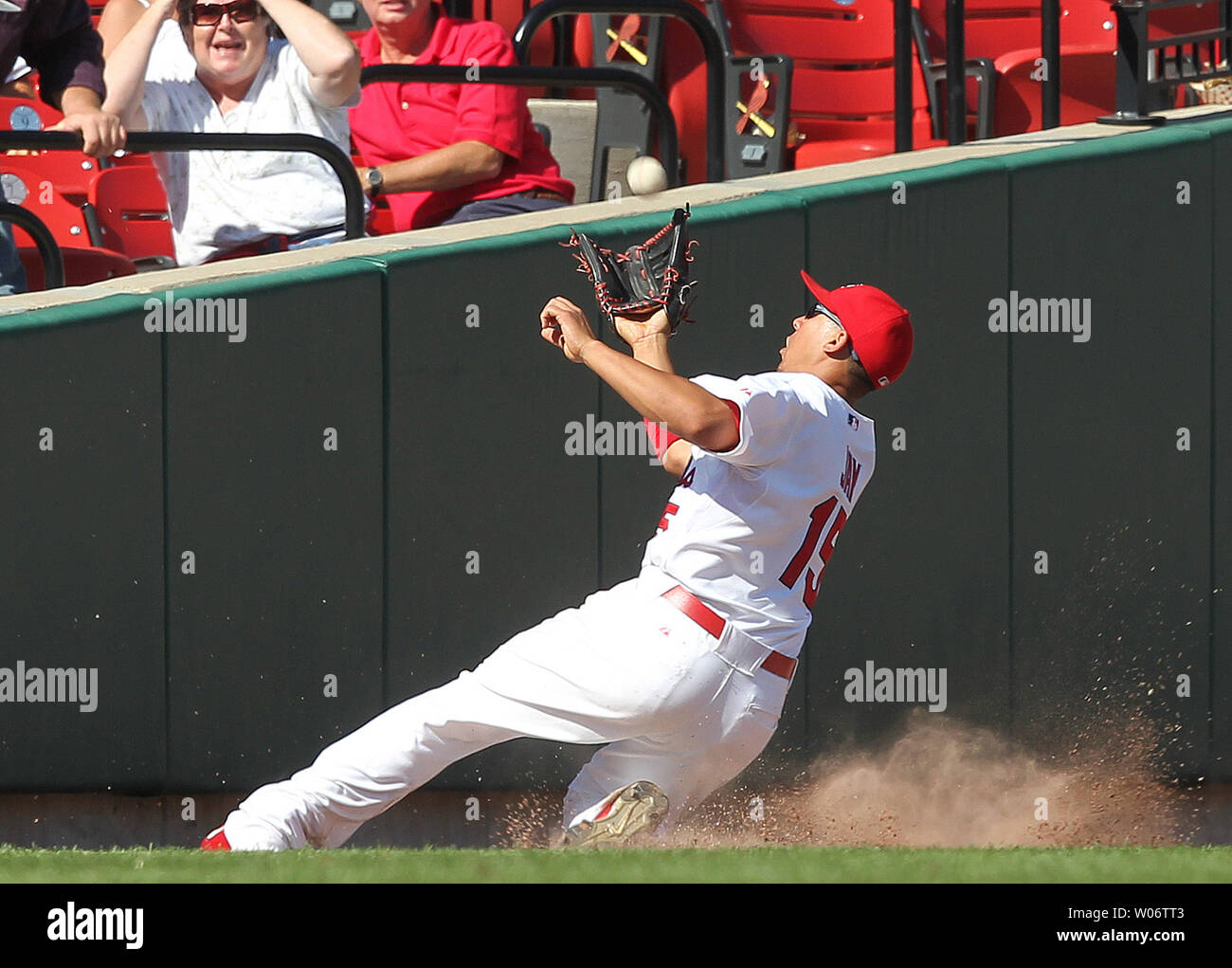 St. Louis Cardinals left fielder Jon Jay slides into the wall as he ...