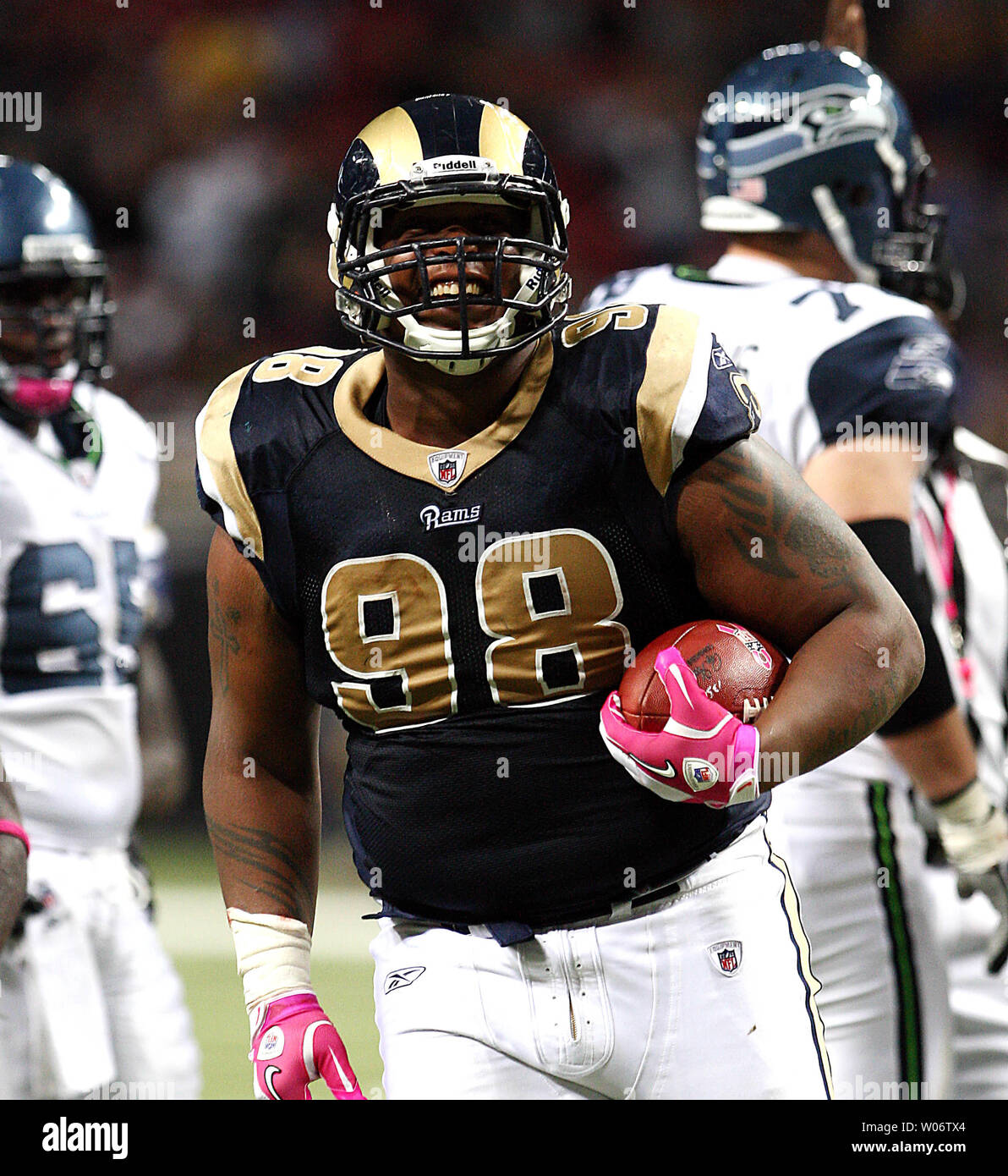 St. Louis Rams Fred Robbins(98) is all smiles after picking up the ...