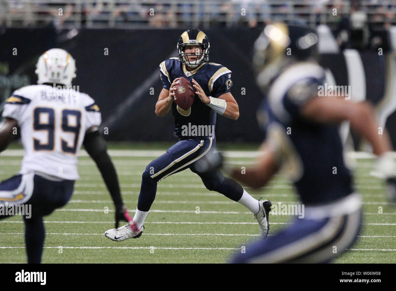 St. Louis Rams quarterback Sam Bradford looks for a receiver downfield ...