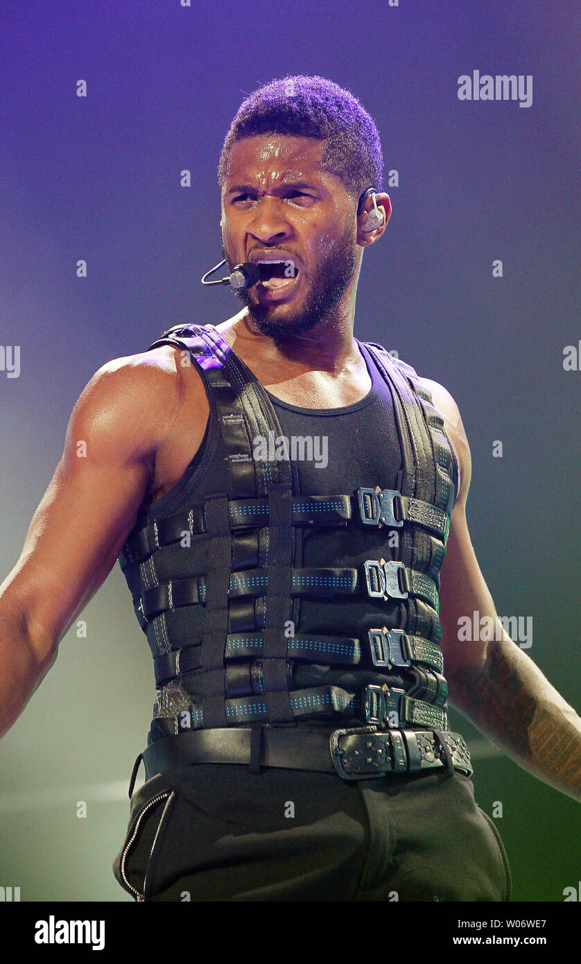 Singer Usher performs on stage at the Scottrade Center in St. Louis on ...