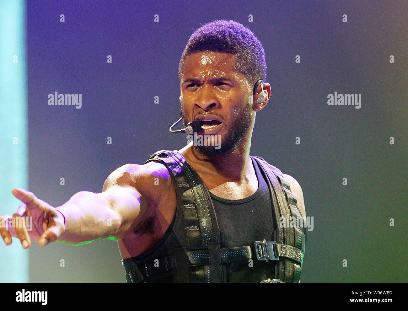 Singer Usher performs on stage at the Scottrade Center in St. Louis on ...