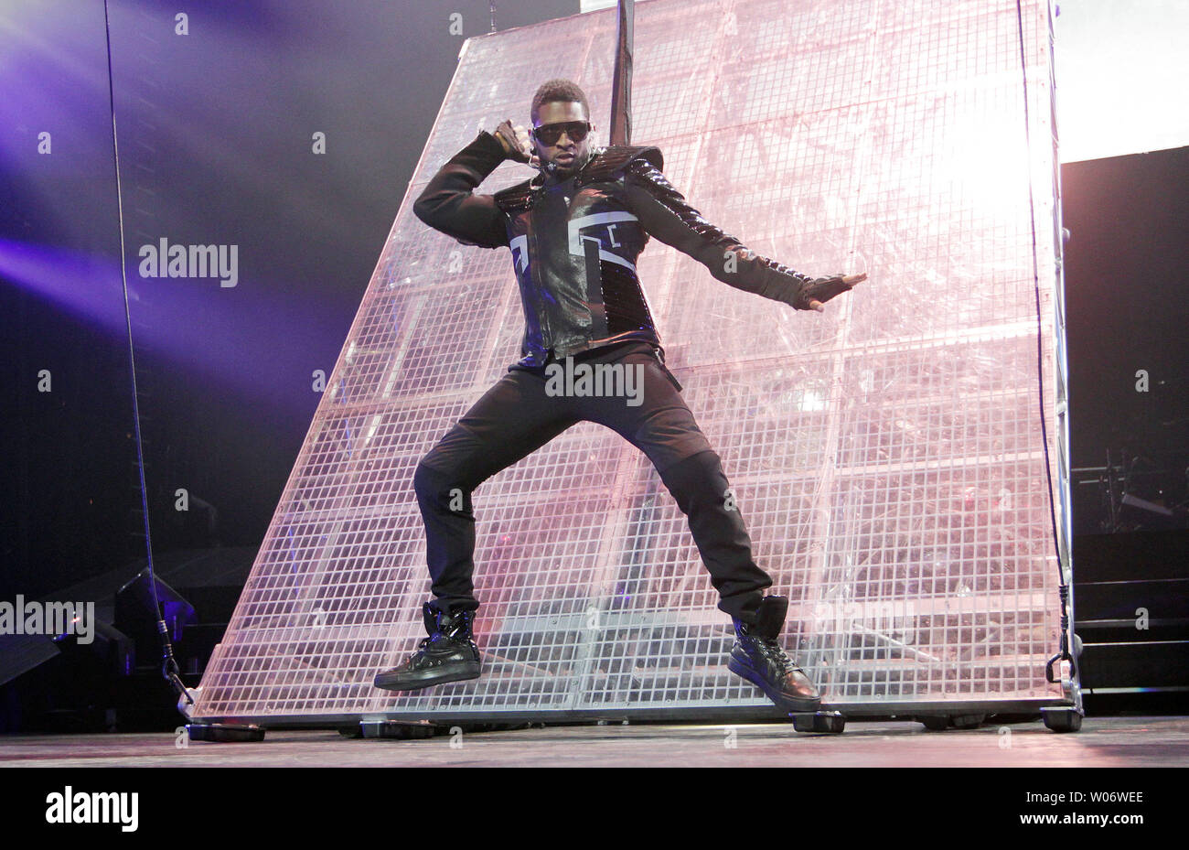 Singer Usher performs on stage at the Scottrade Center in St. Louis on ...