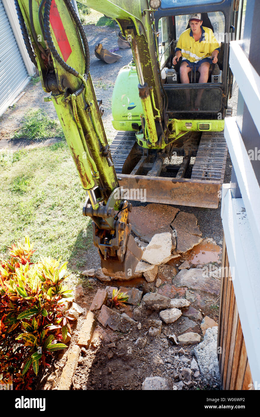 EXCAVATOR BREAKING UP CONCRETE Stock Photo - Alamy