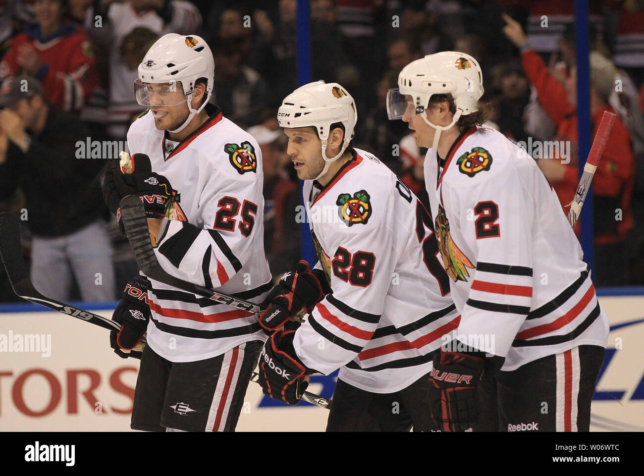Chicago Blackhawks Jake Dowell (28) skates off the ice with teammates ...