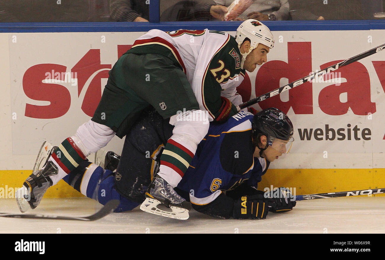Minnesota Wild Eric Nystrom (23) falls on top of St. Louis Blues Erik ...