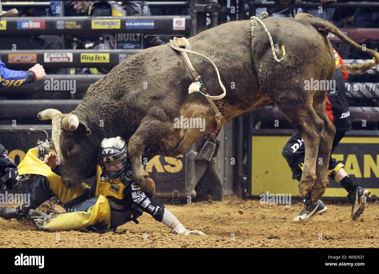 Professional Bull Rider Cody Nance is jumped on by Gray Squirrel, the ...